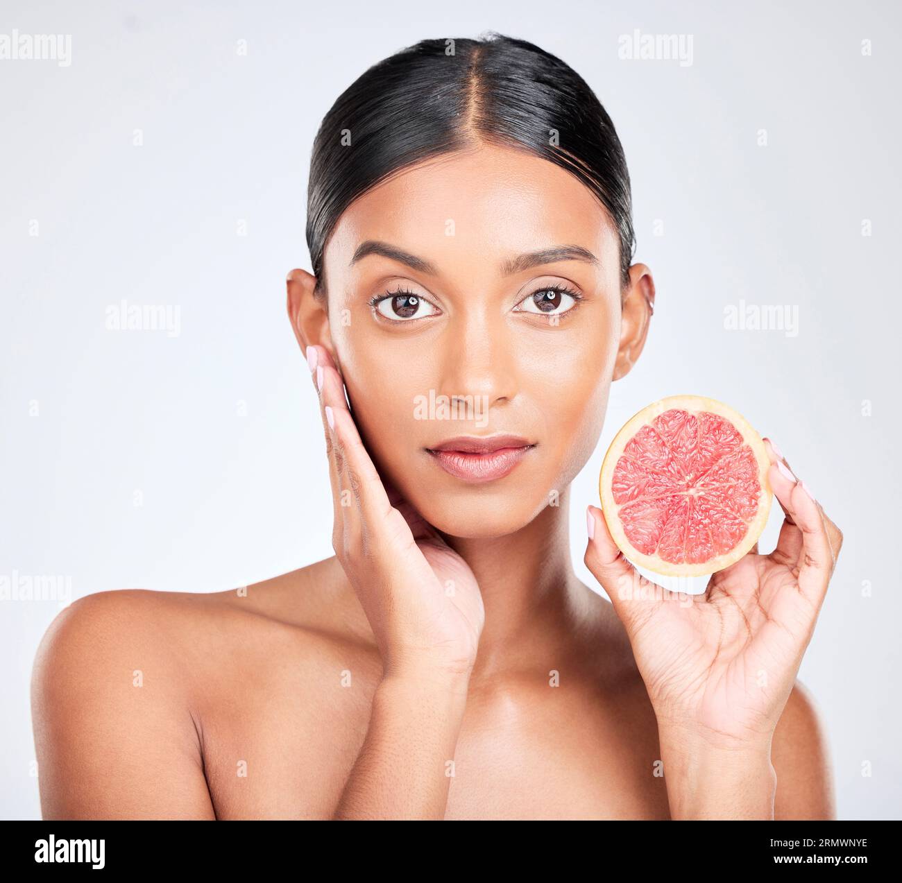 Face, woman with grapefruit and natural beauty, facial and eco friendly ...