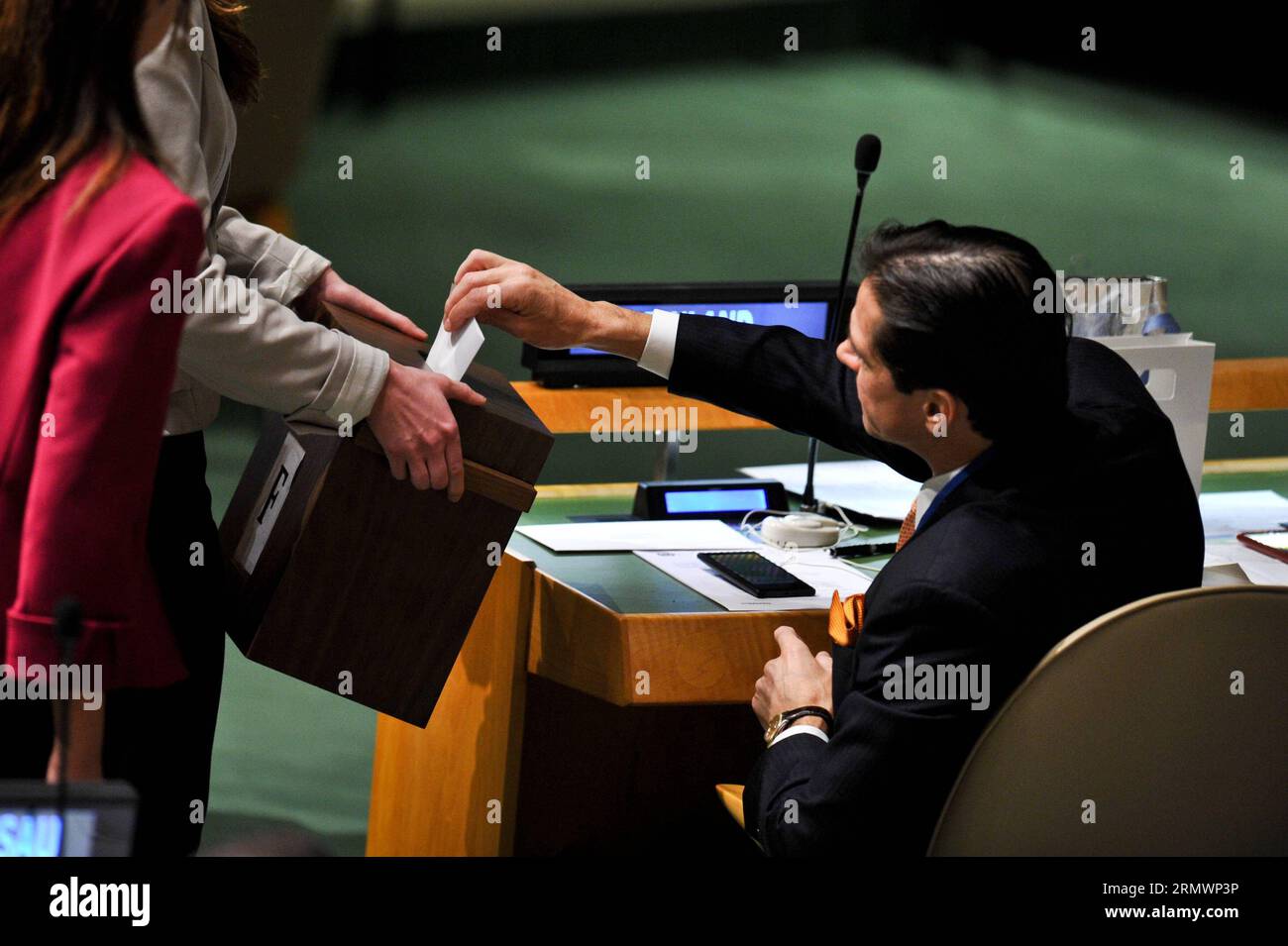 (141107) -- NEW YORK, A diplomat casts his ballot during a UN General Assembly election of ...