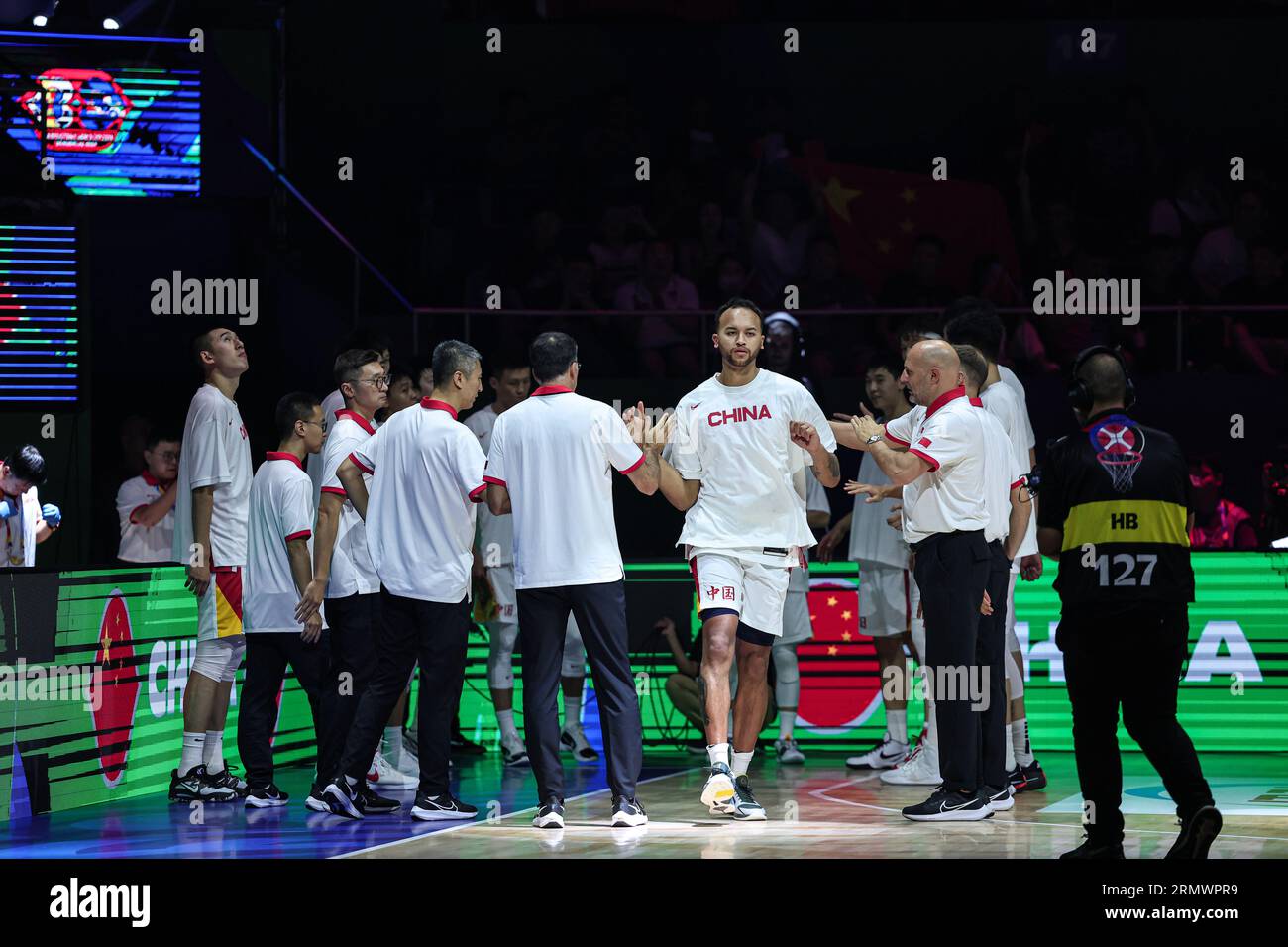 Manila, Philippines. 30th Aug, 2023. Li Kaier (2nd R, front) reacts ...