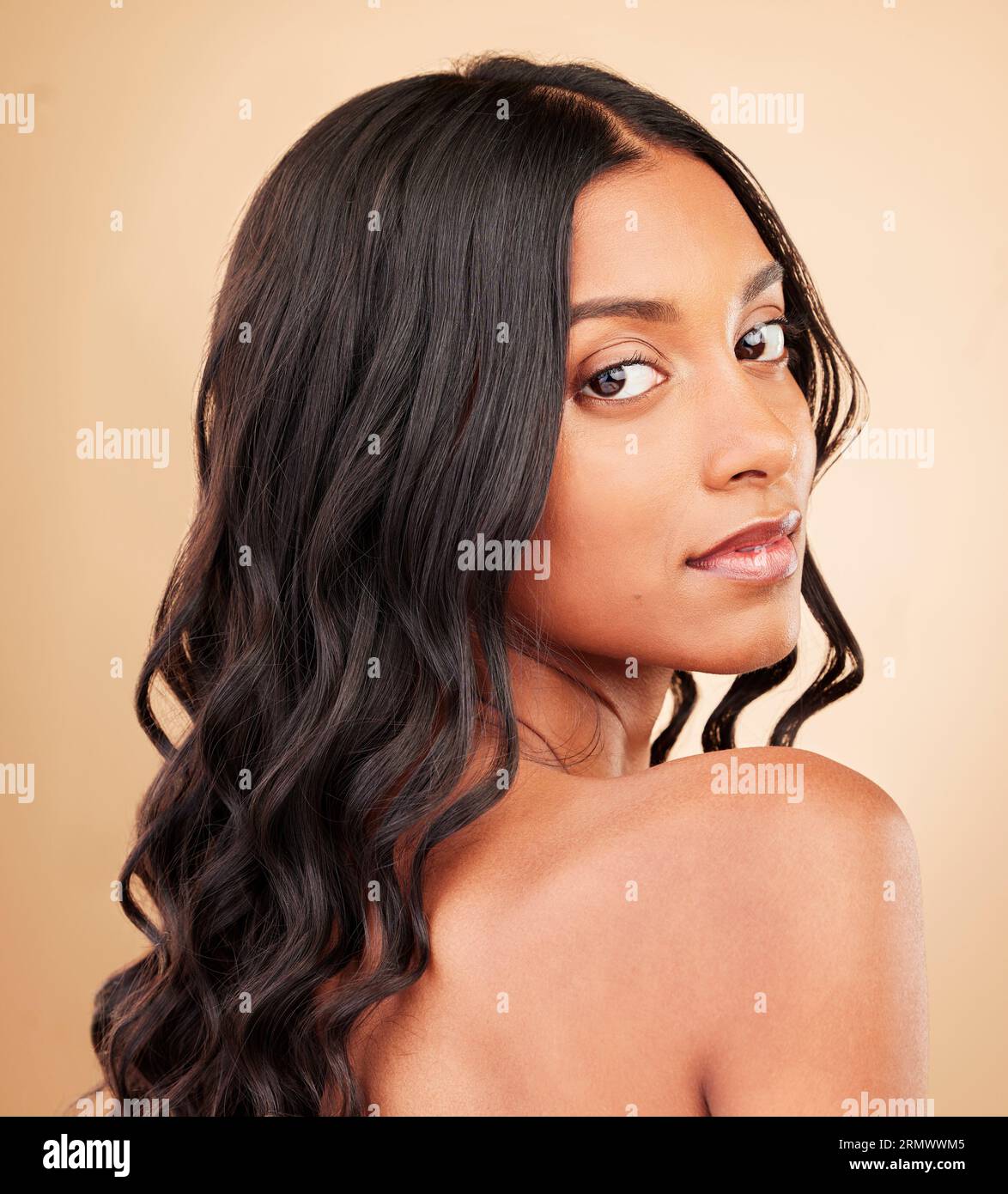 Portrait, hair care and woman with beauty, glow and luxury with grooming on a brown studio ...
