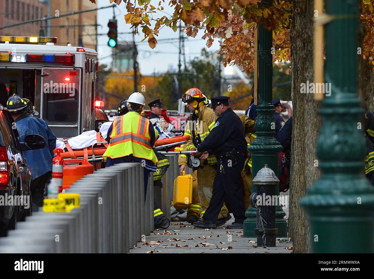 (141112) -- NEW YORK, Nov. 12, 2014 -- Firefighters carry the window ...