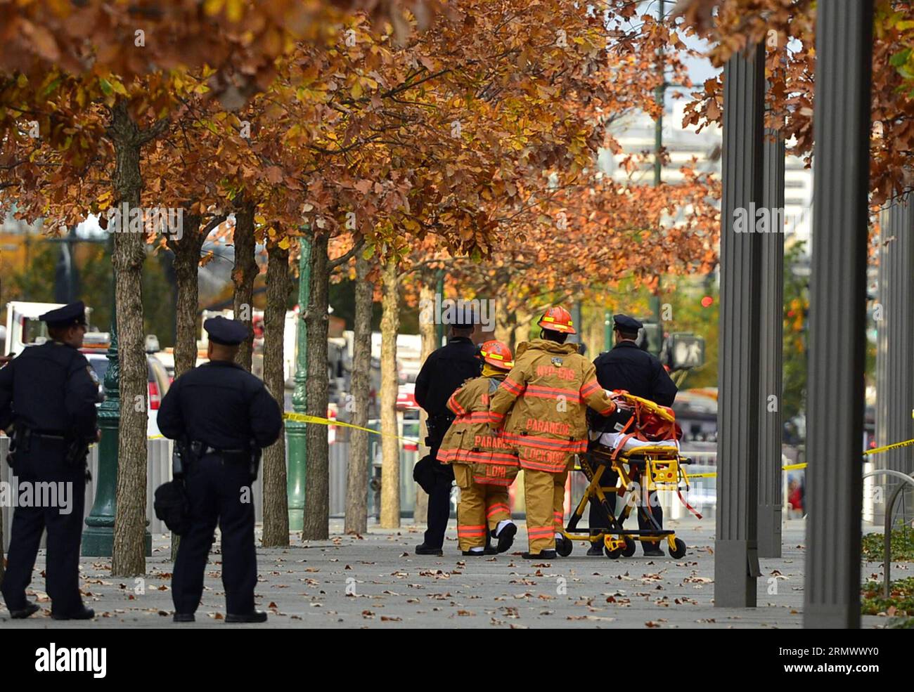 (141112) -- NEW YORK, Nov. 12, 2014 -- Firefighters carry the window ...