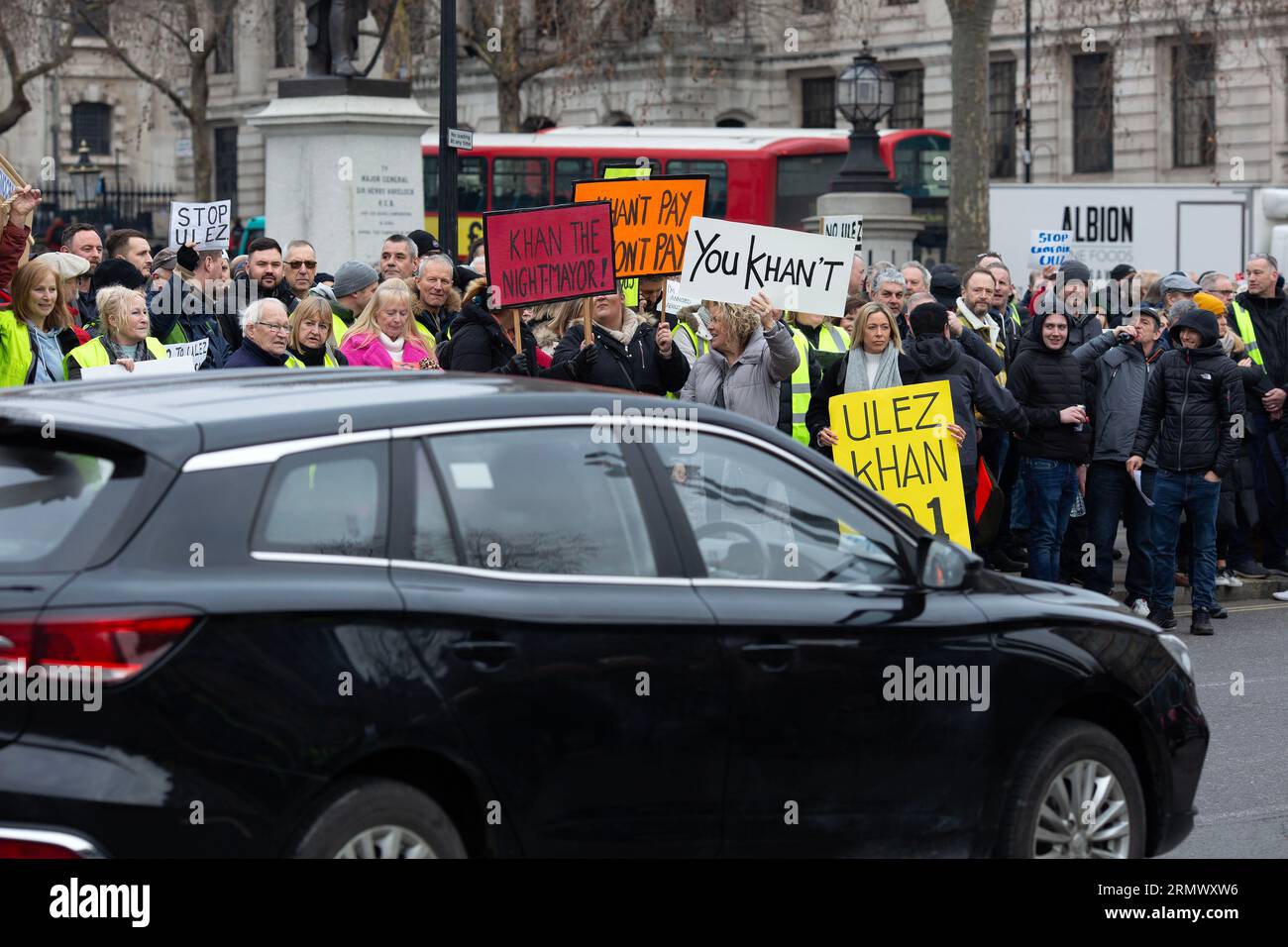 Participants gather with placards during a protest against the ...