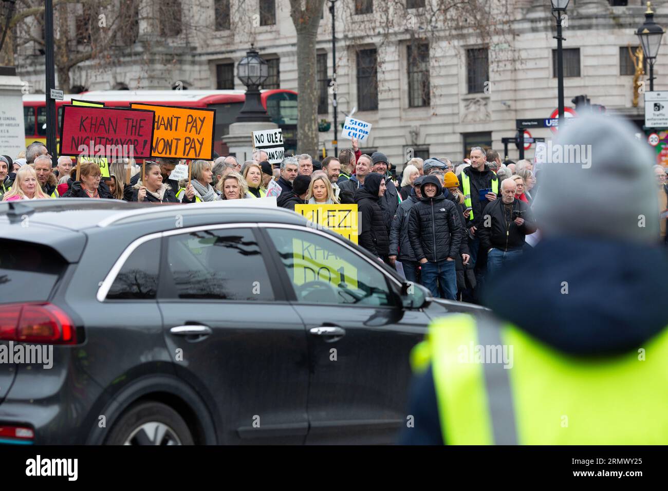Participants gather with placards during a protest against the ...