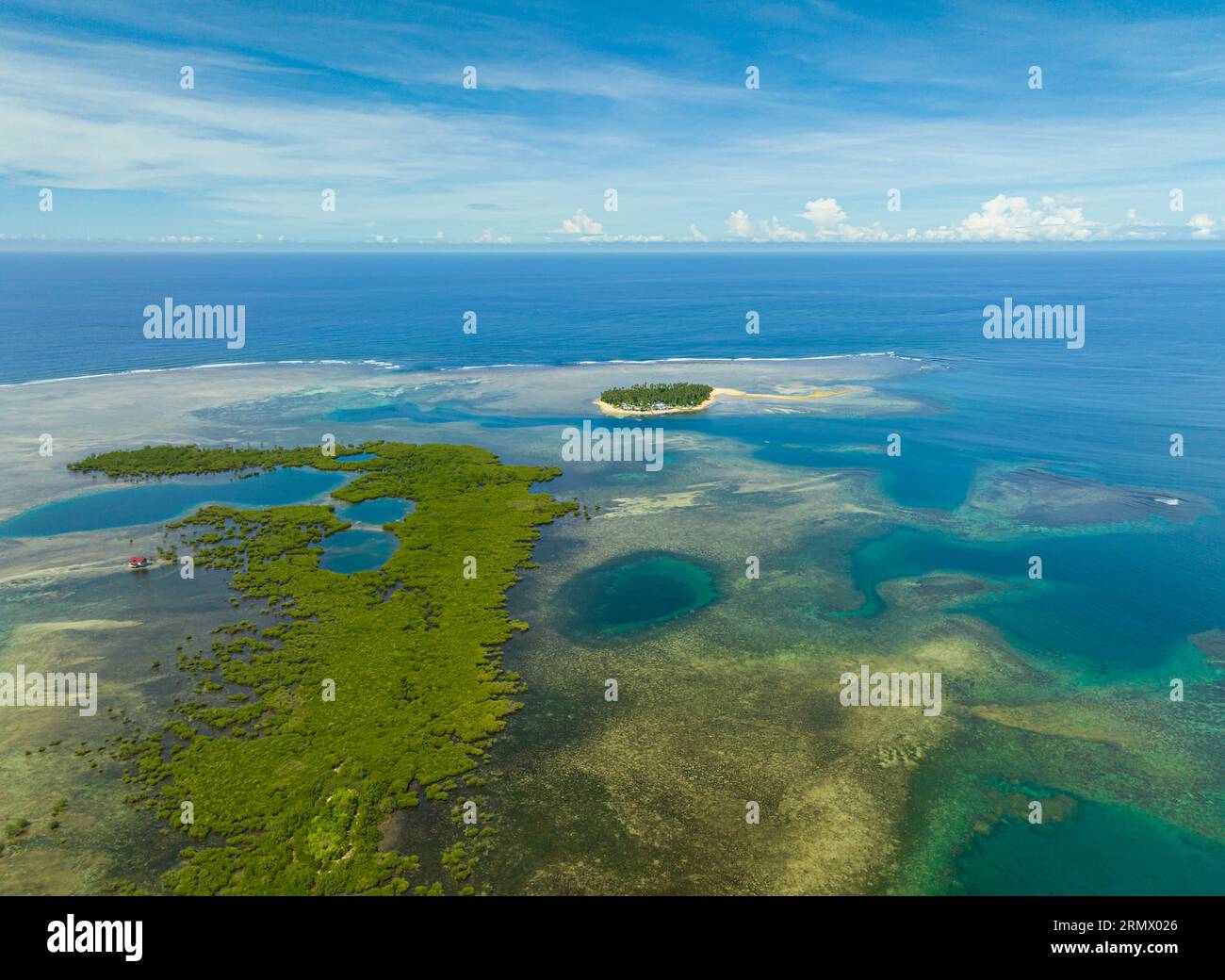 Turquoise water surrounded in tropical small island with white sandy ...