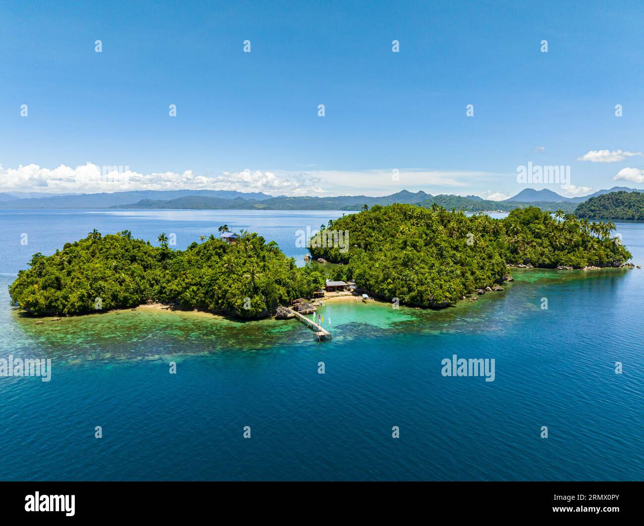 Aerial view of turquoise sea water and coral reefs in tropical island ...