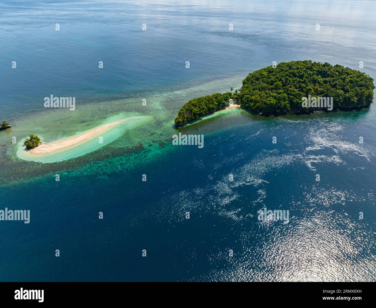 Aerial view of tropical island with sandy beach and blue sea. Millari ...