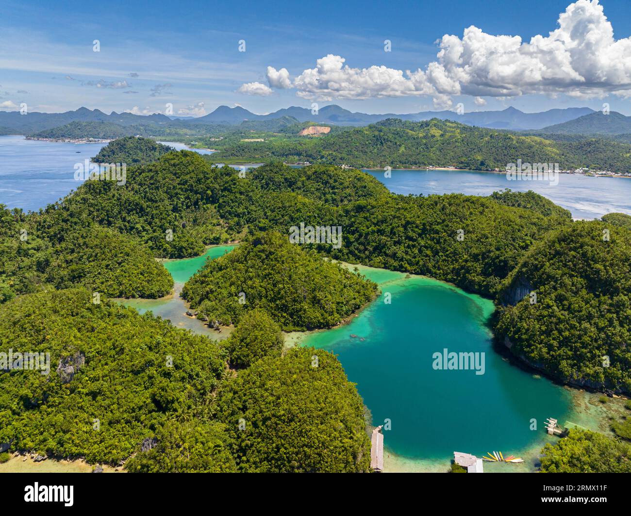 Small islets and turquoise water in lagoons. Beautiful blue sky and ...