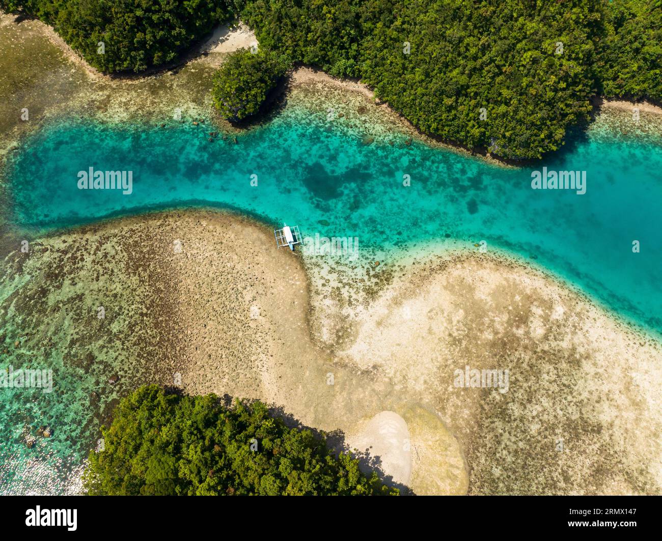 Flying above of natural transparent turquoise water in lagoon with ...