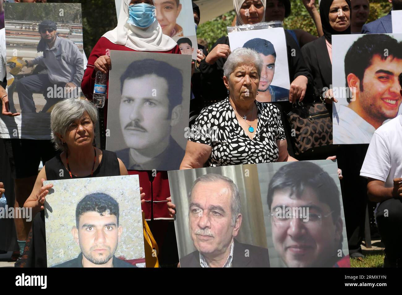 Beirut, Lebanon. 30th Aug, 2023. Syrian Fadwa Mahmoud (C), and Lebanese ...
