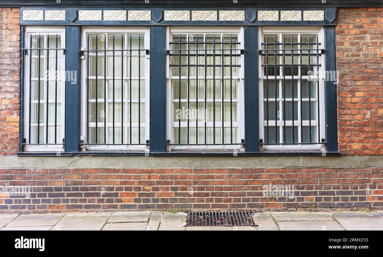 A quad of barred windows at ground level, Oxford, England Stock Photo ...