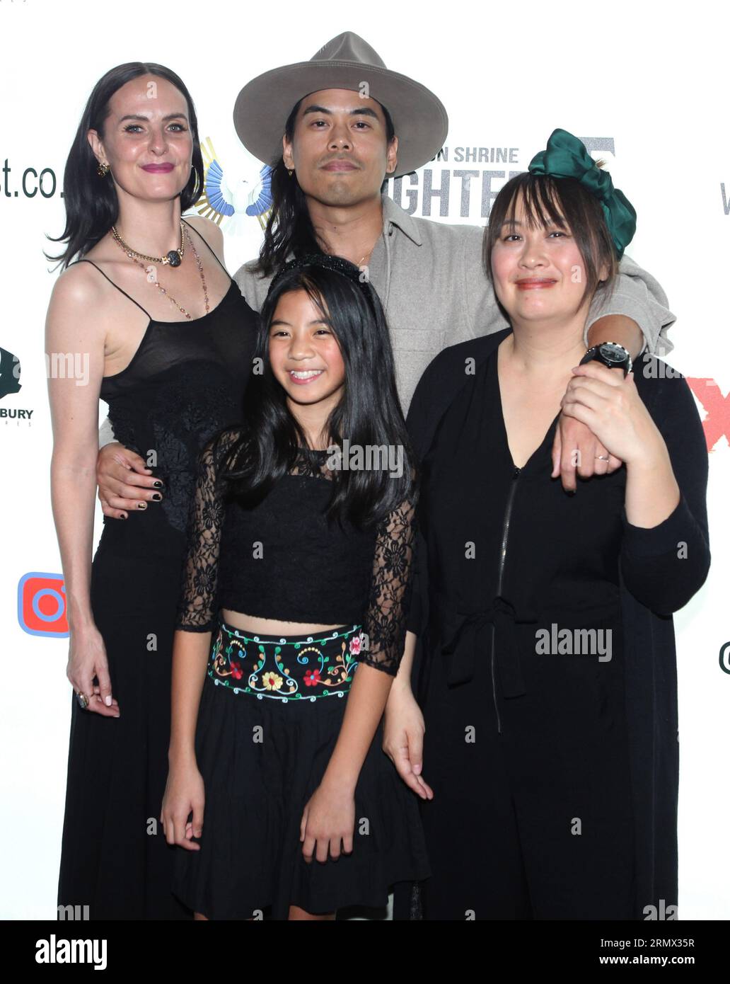 London, UK. Paris Zarcilla (hat) with Leanne Best (black dress) and ...
