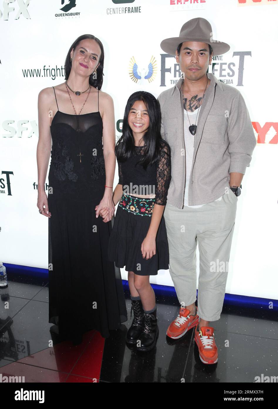 London, UK. Paris Zarcilla (hat) with Leanne Best (black dress) and ...