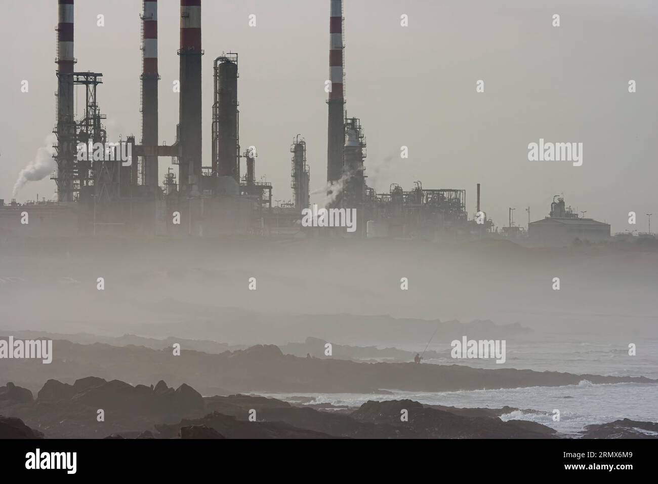 Old oil refinery by the sea in a foggy day Stock Photo - Alamy