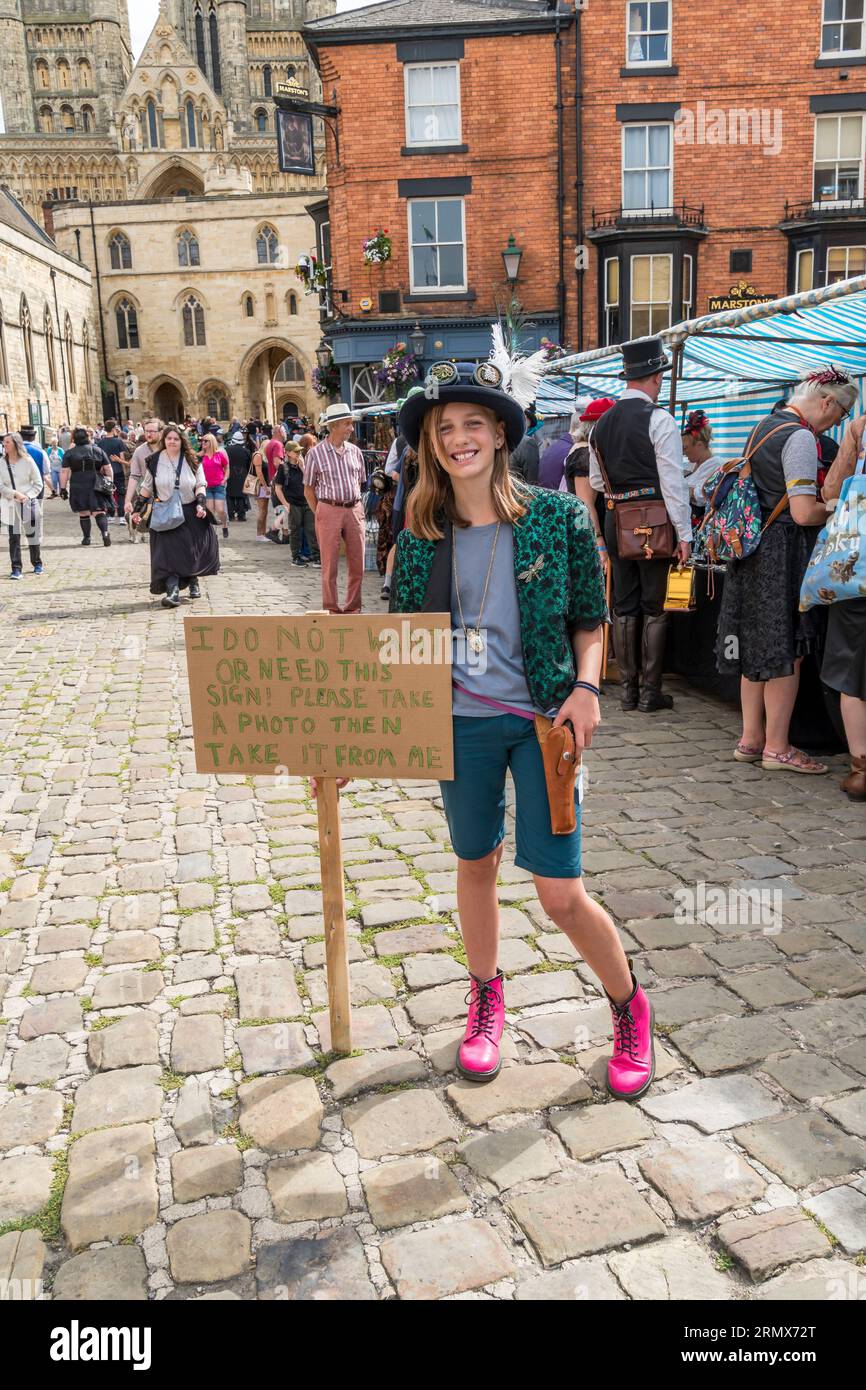 Young girl carrying sign, Castle Hill, Lincoln City, Lincolnshire ...