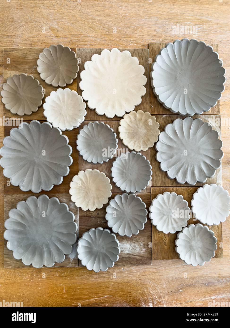 Ceramic plates and bowls drying before being bisque fired Stock Photo ...