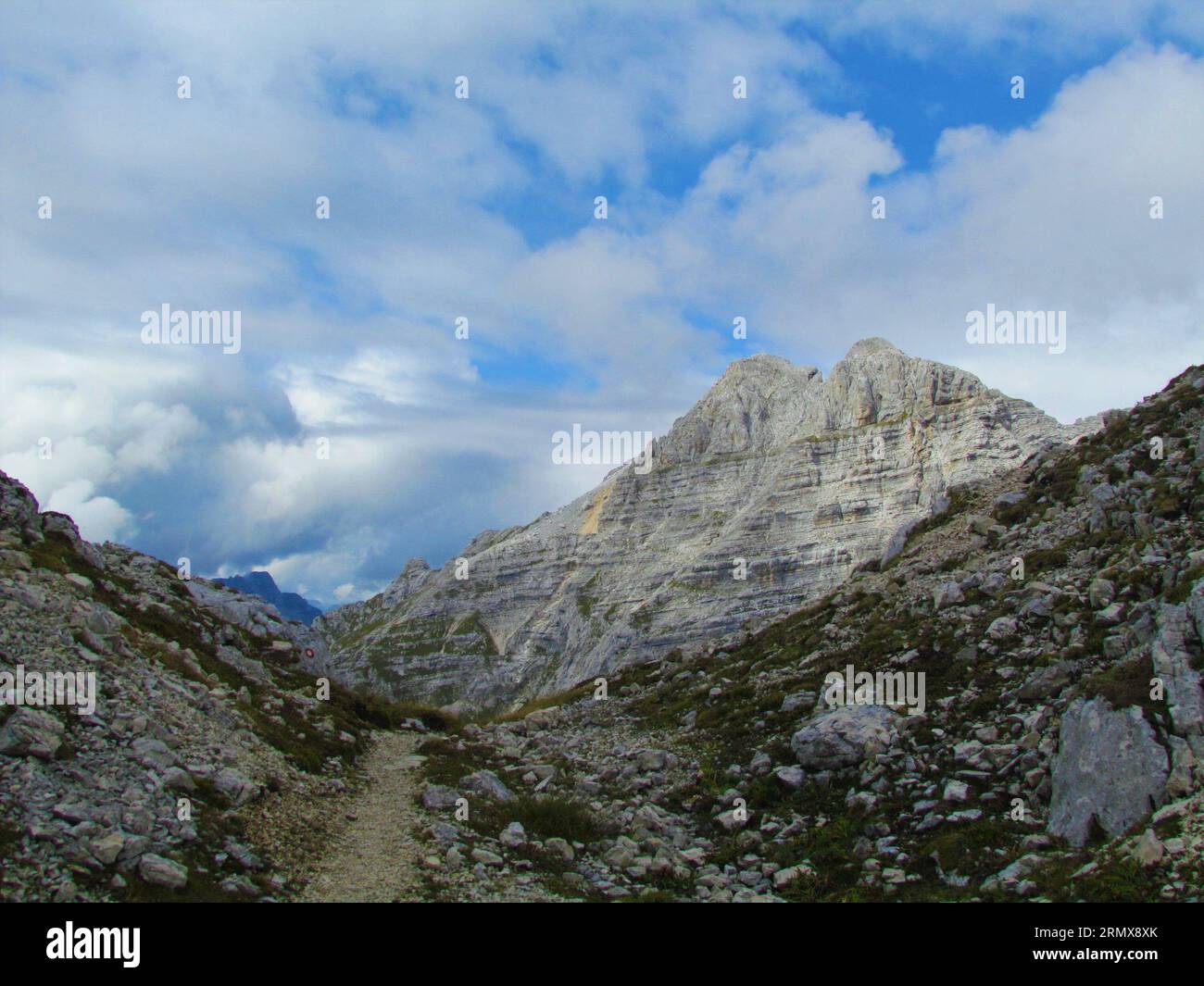 Rocky high alpine mountain landscape with patches of grass at Kriski ...