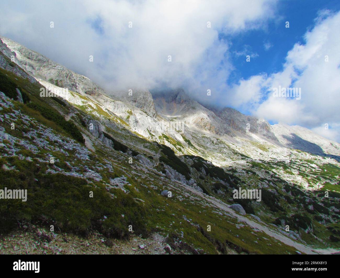 Scenic view of sunlit alpine landscape in Triglav national park and ...