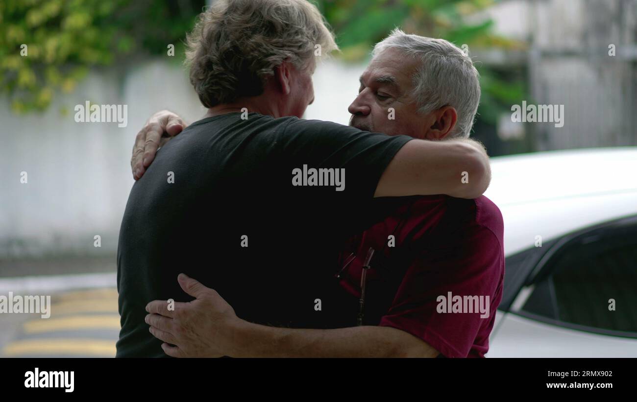 Authentic Loving Embrace Between Two Senior Friends Saying Farewell ...
