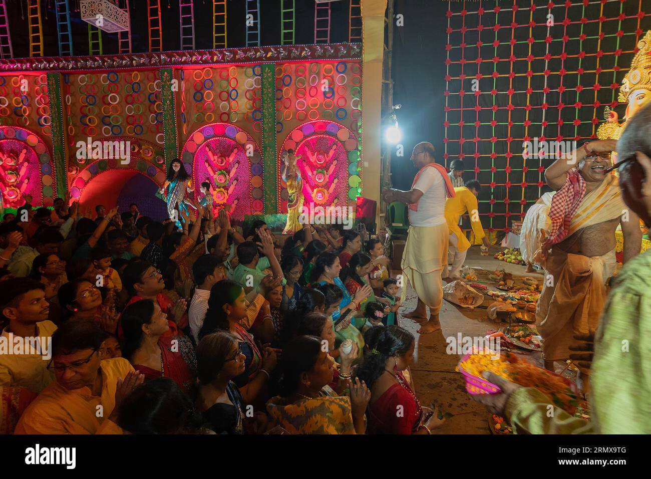 Howrah,West Bengal,India- 3rd October, 2022 : Hindu purohit spraying ...