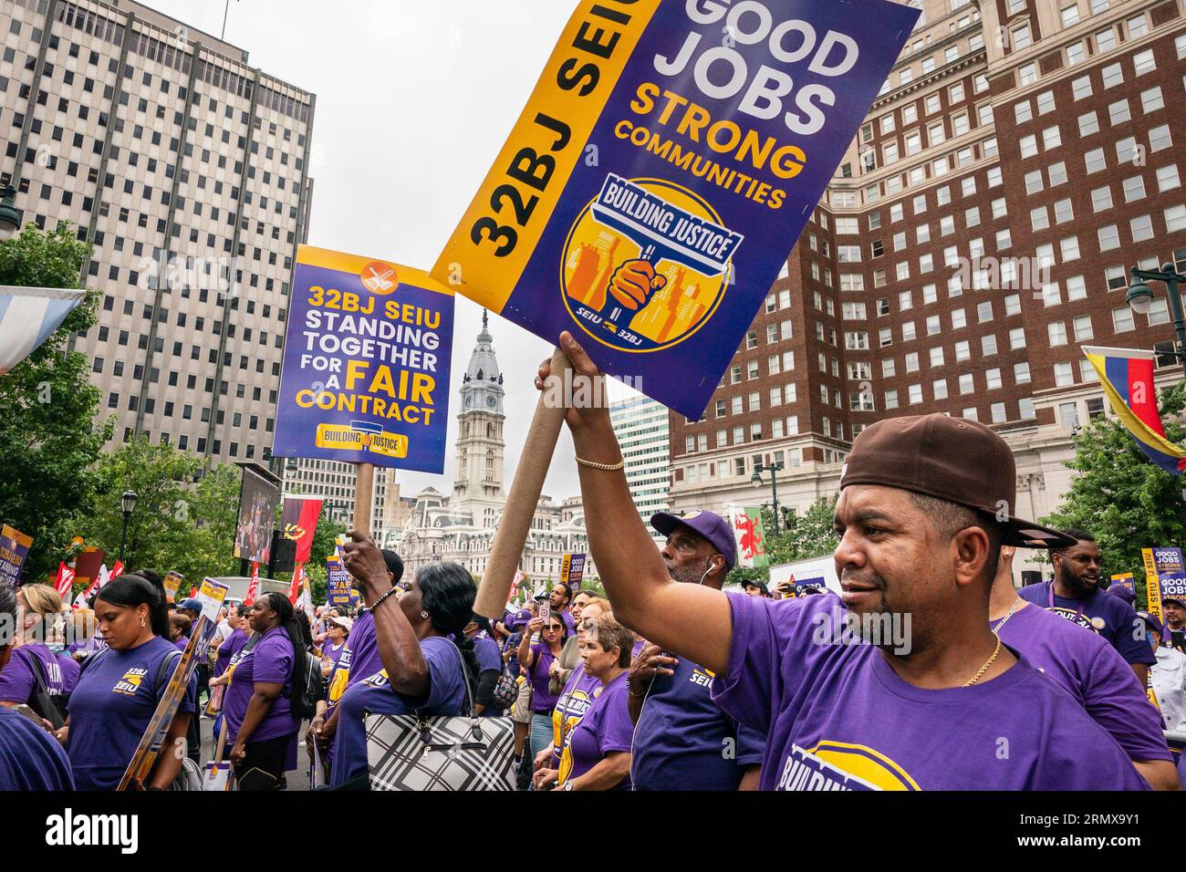Adoni T Gonzalez holds a sign and protests as members of SEIU 32BJ ...
