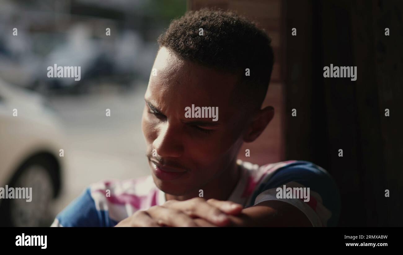 Worried African American young person feeling emotion pressure with ...