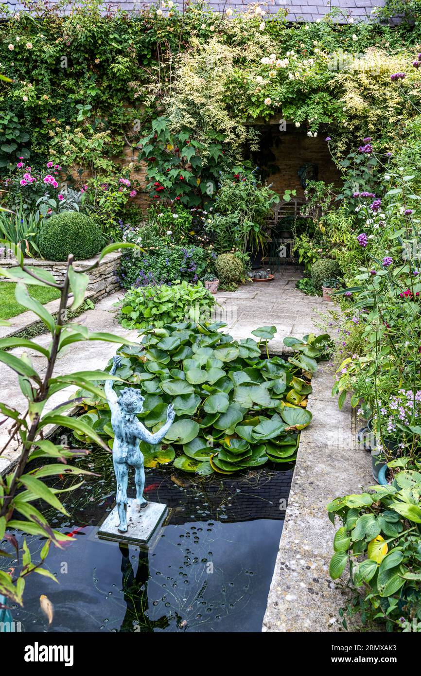 Pond on terrace in secluded garden of 18th century Georgian house ...