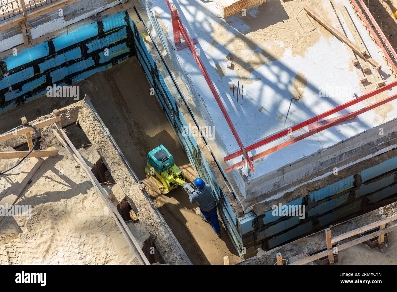 soil compaction with vibratory plate on the basement Stock Photo - Alamy