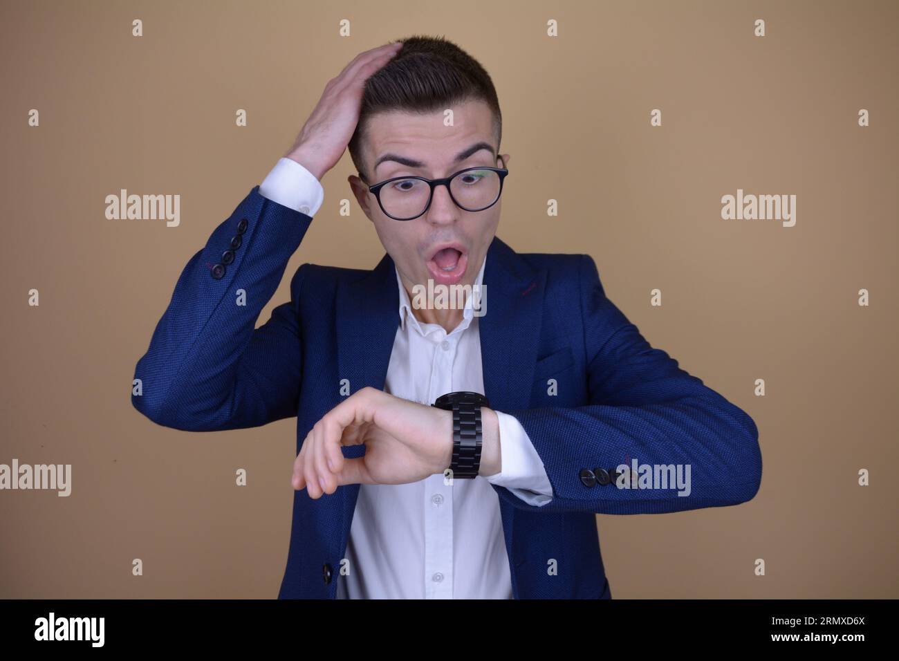 Shocked Young Handsome Elegant Man Checking Time on His Watch and ...