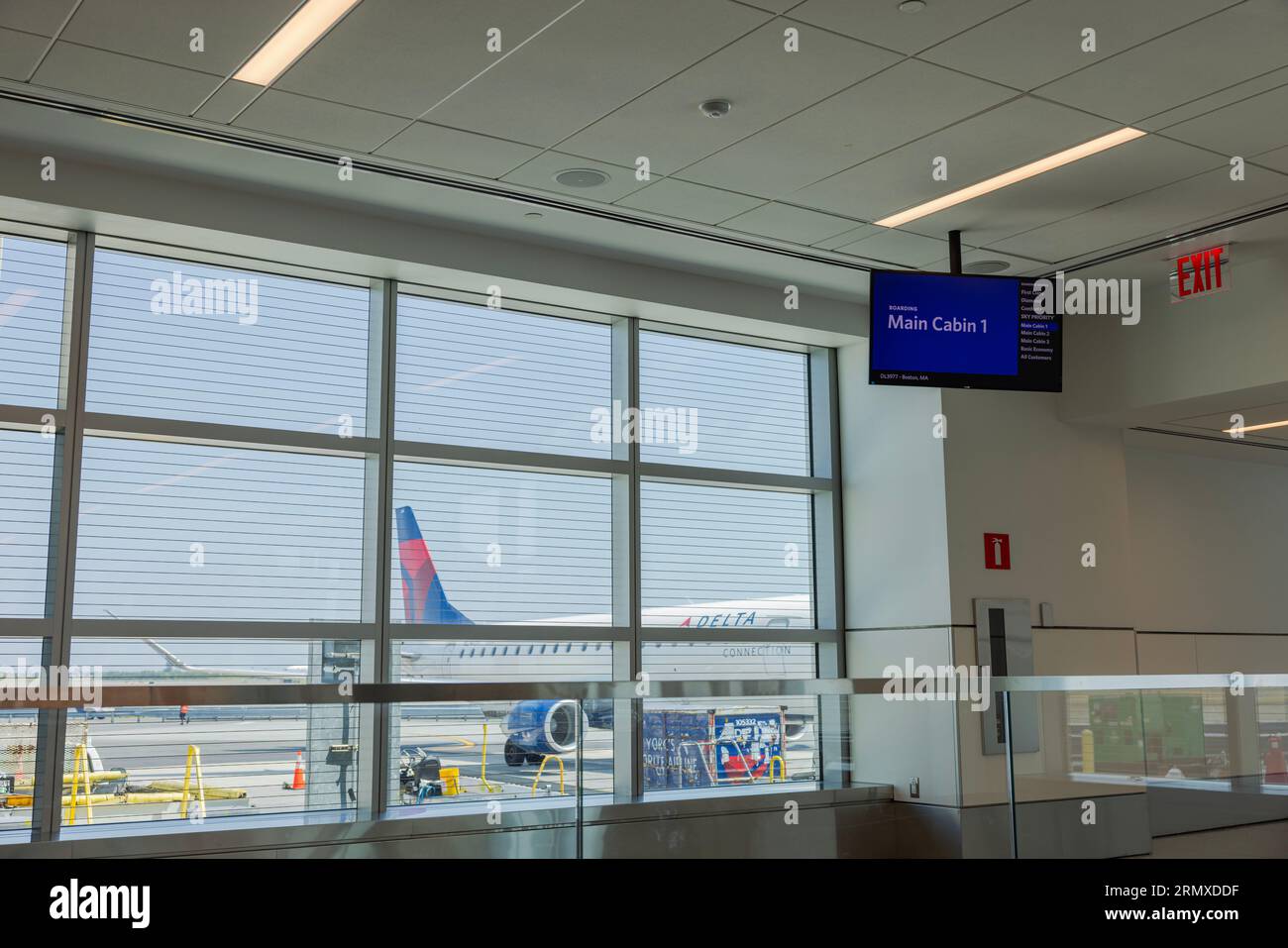 View of invitation board at airport for main cabin passengers going on ...