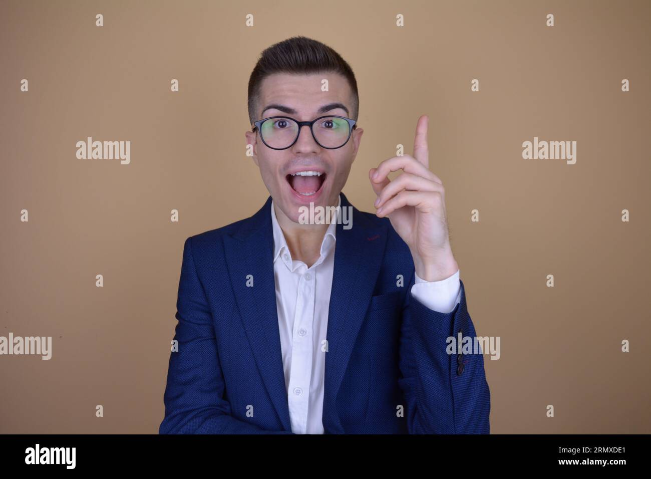 Young Handsome Elegant Man with Finger Raised, Struck by a Brilliant ...