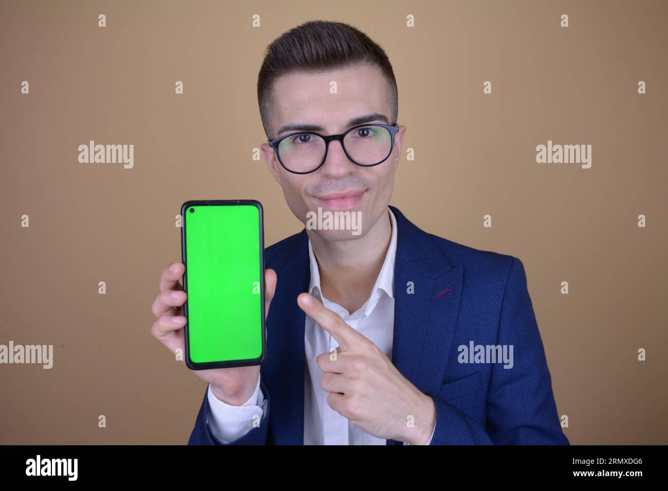 Elegant Young Man Pointing at Green Smartphone Display on Isolated ...