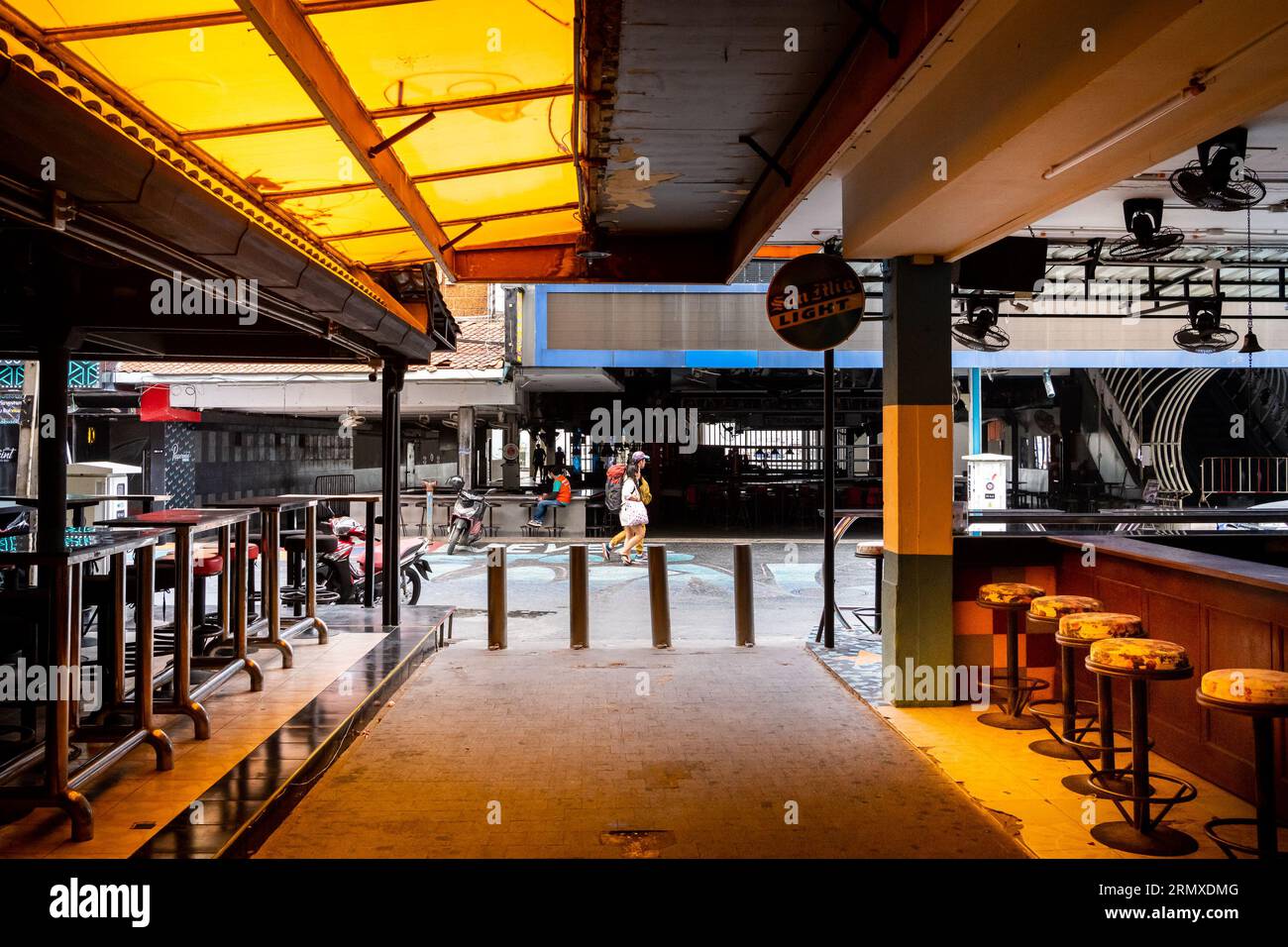Looking through the some empty beer bars on to Walking Street, Pattaya ...