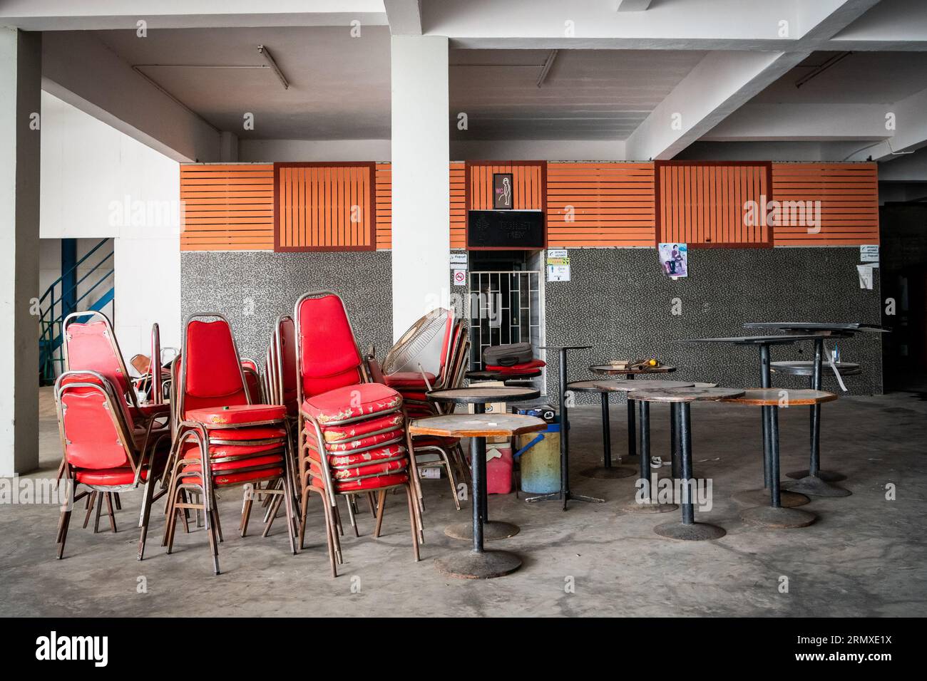 Seats and tables piled up in an empty restaurant on Walking St. Pattaya ...