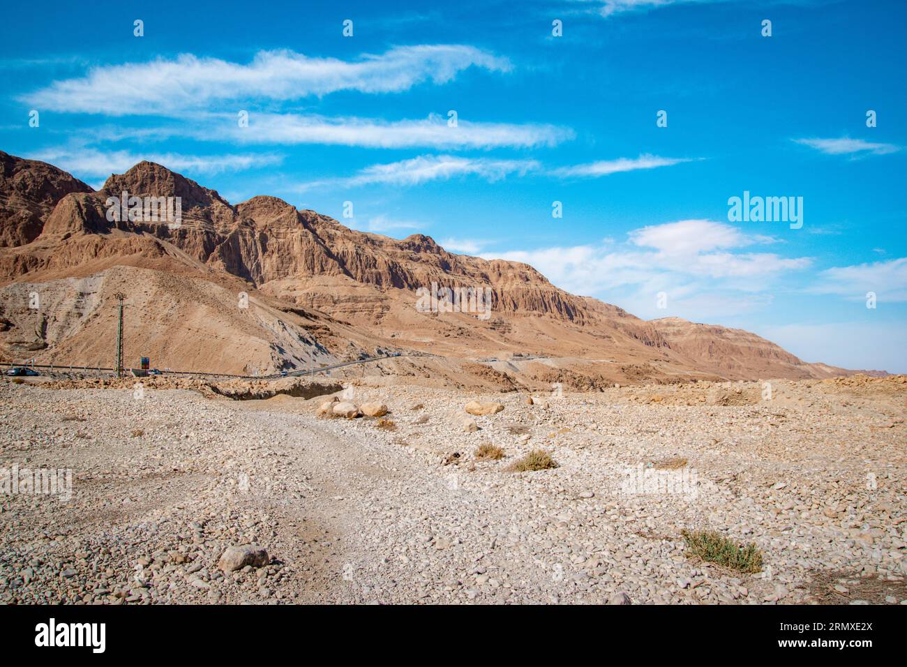 A long wooden fence that winds through a scenic landscape of rocky ...