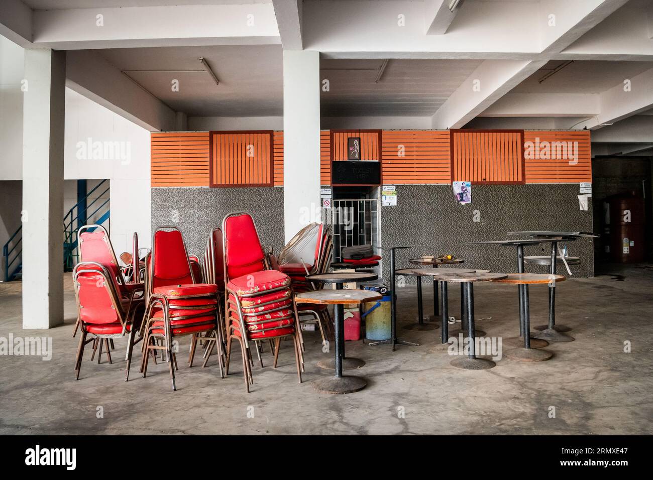 Seats and tables piled up in an empty restaurant on Walking St. Pattaya ...