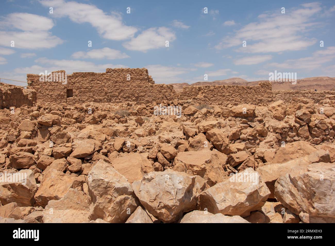 A barren desert landscape featuring a vast expanse of sandy terrain ...