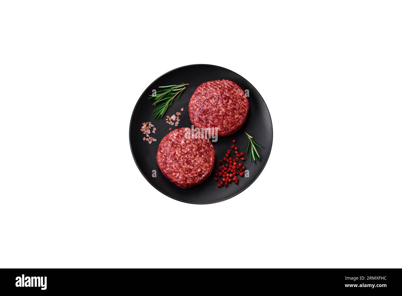 Fresh raw ground beef burger patty with salt and spices on textured ...