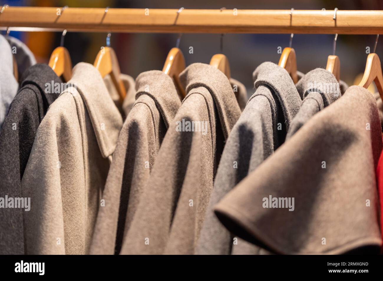 Coats hanging on a rack hi-res stock photography and images - Alamy