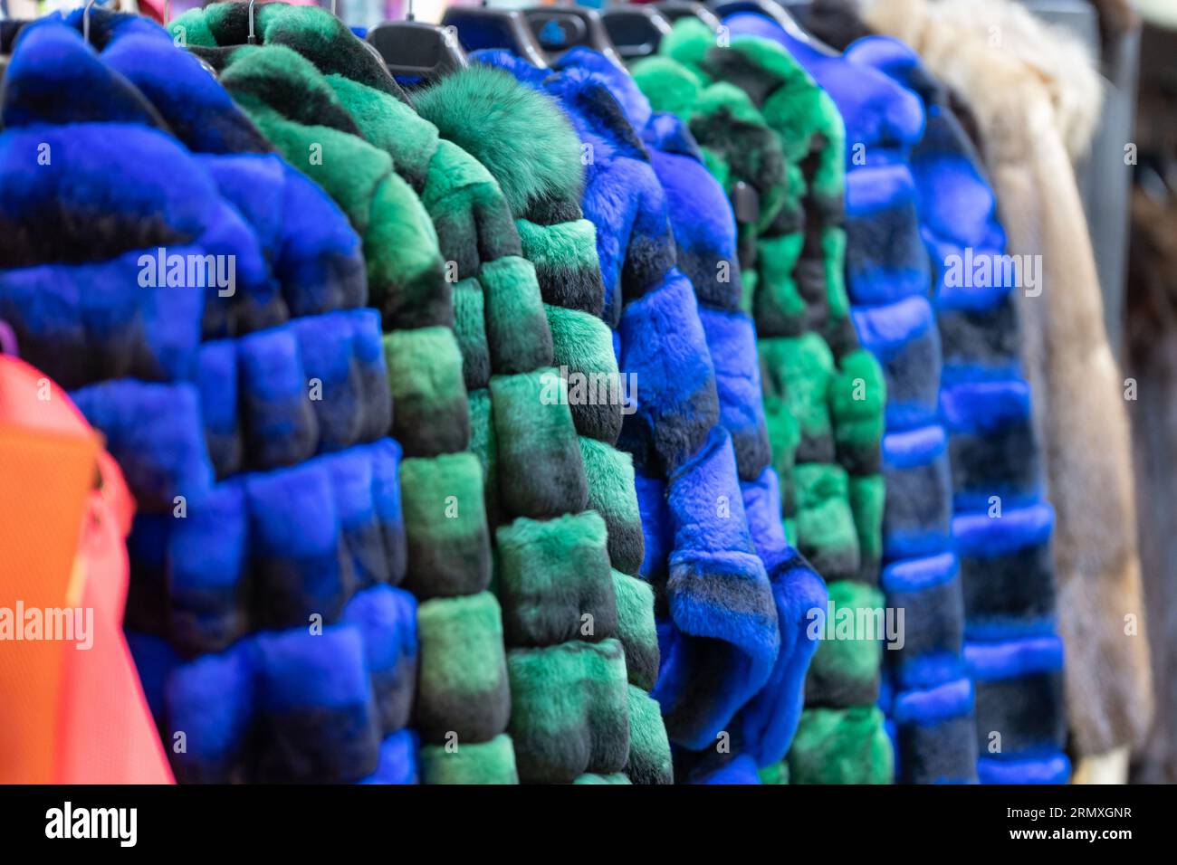 Coats hanging on a rack hi-res stock photography and images - Alamy
