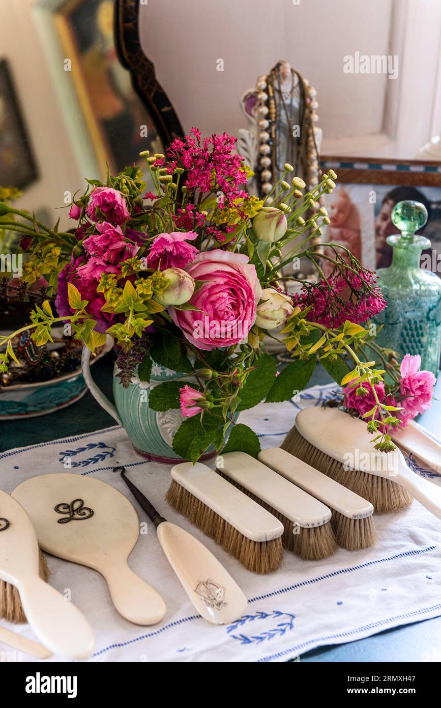 Antique brush set and cut roses in 18th century flower loft conversion ...