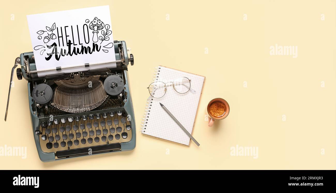 Vintage typewriter with text HELLO AUTUMN on light background Stock ...