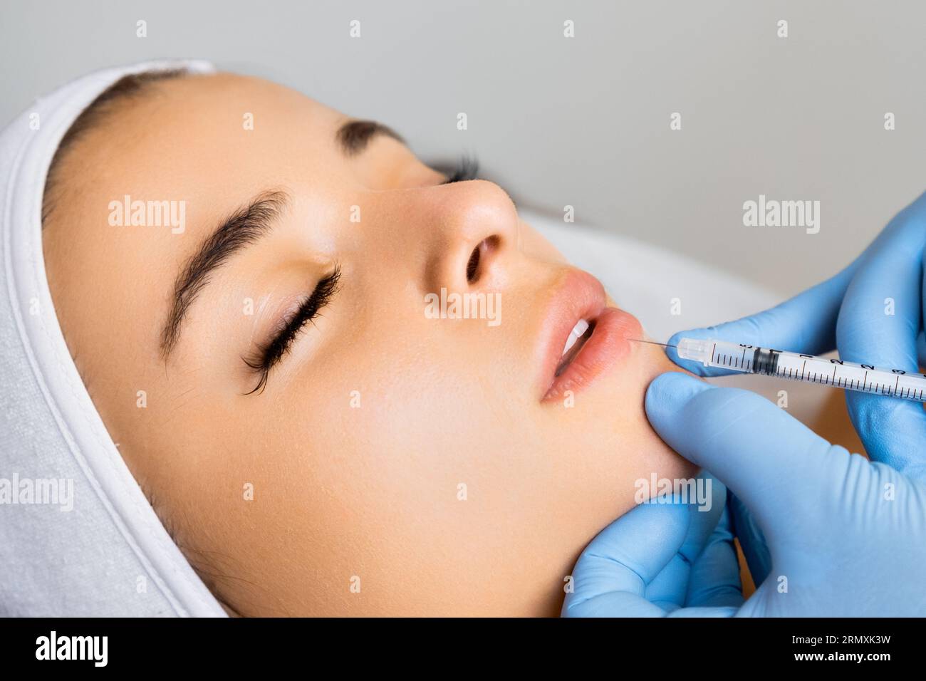 Beauty injection for lip augmentation in a beauty salon Stock Photo - Alamy