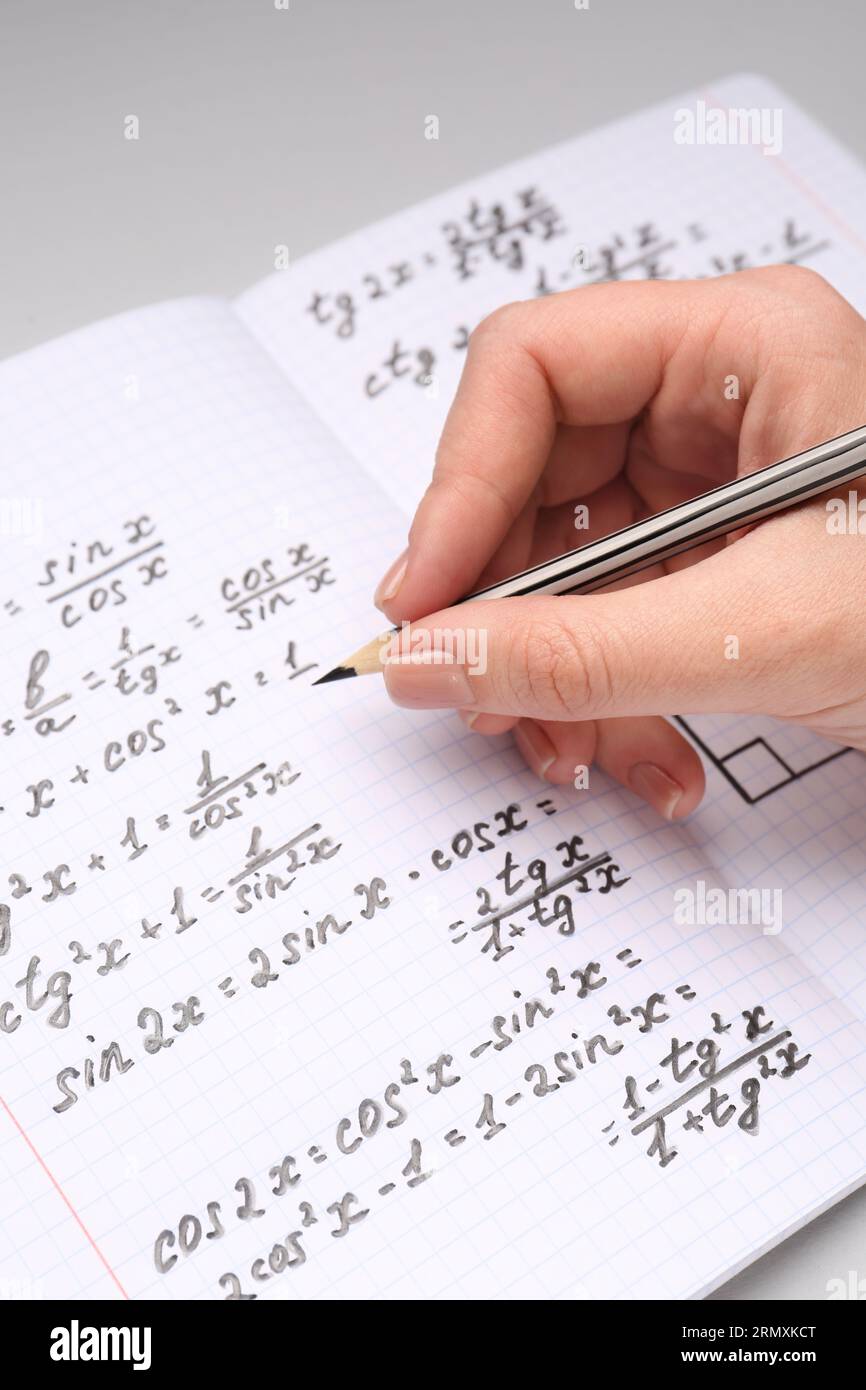 Woman writing maths formulas hi-res stock photography and images - Alamy