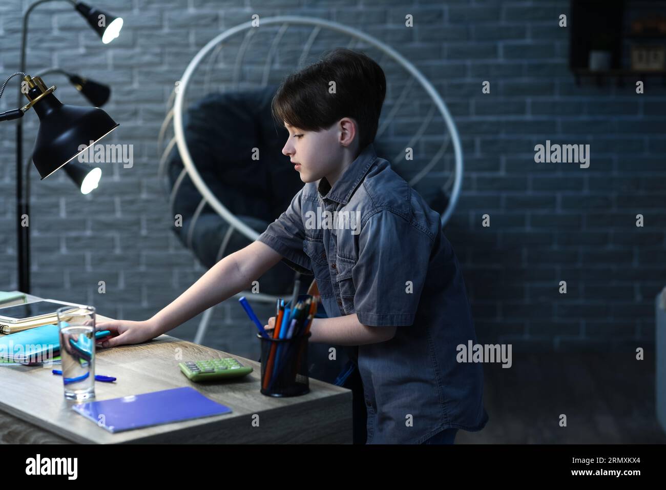 School boy studying night in hi-res stock photography and images - Alamy