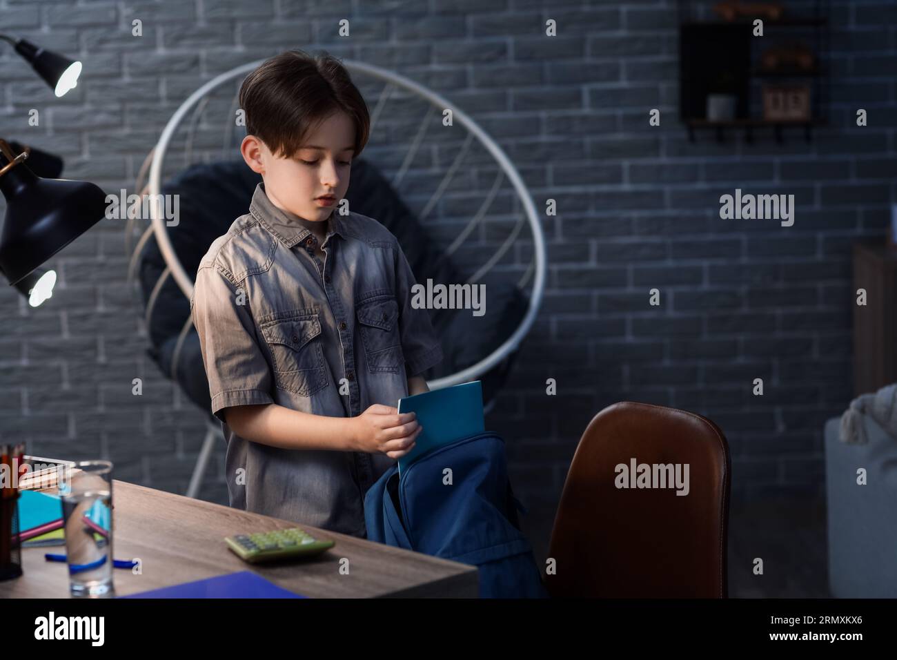 School boy studying night in hi-res stock photography and images - Alamy