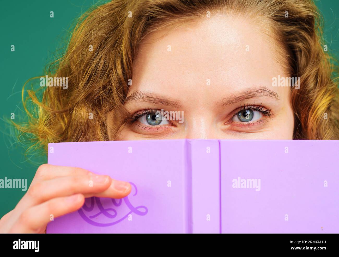 Closeup portrait of female teacher with notepad. School supplies ...