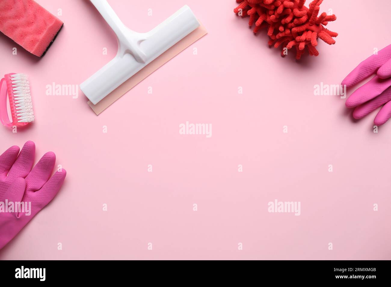 Frame made of different cleaning supplies on pink background Stock ...