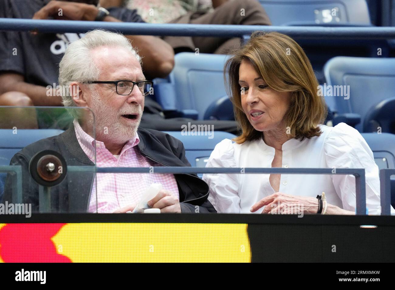 Wolf Blitzer, left, watches play with his wife Lynn Greenfield during ...