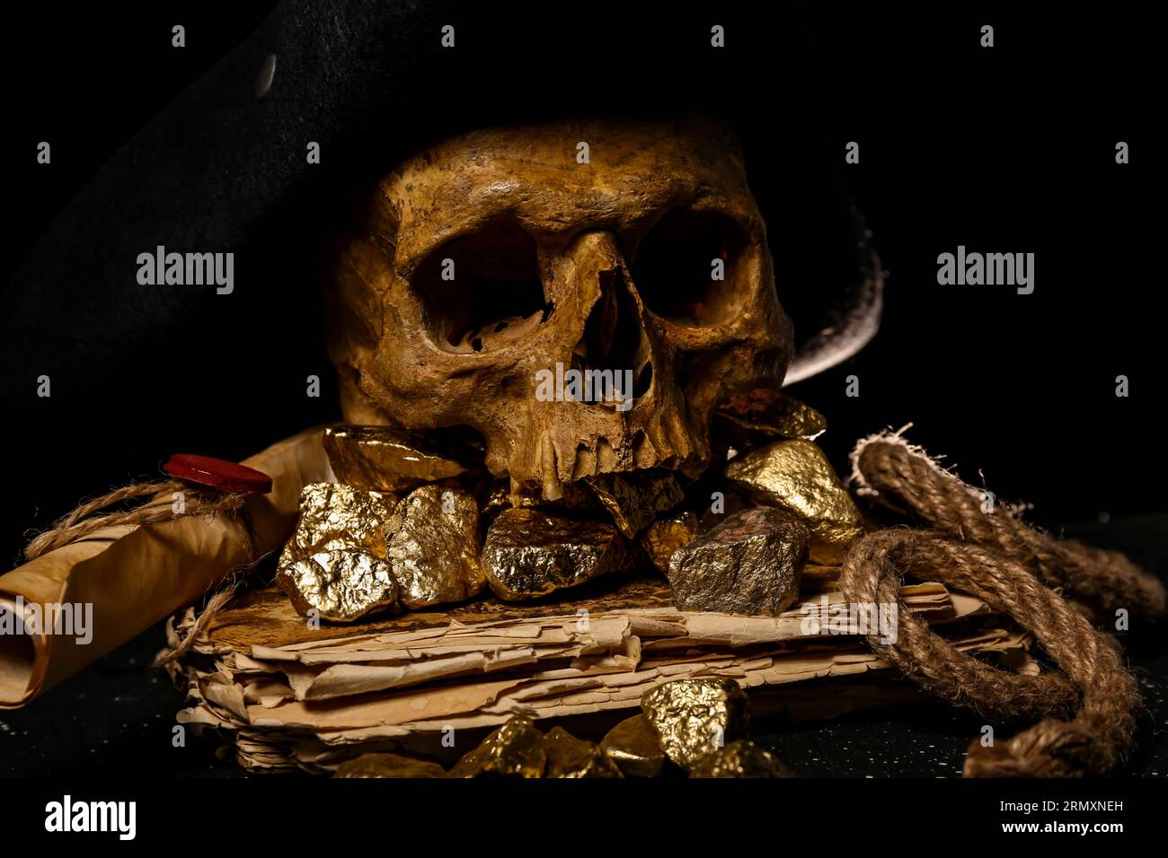Travel equipment with golden nuggets, human skull, old manuscripts and ...